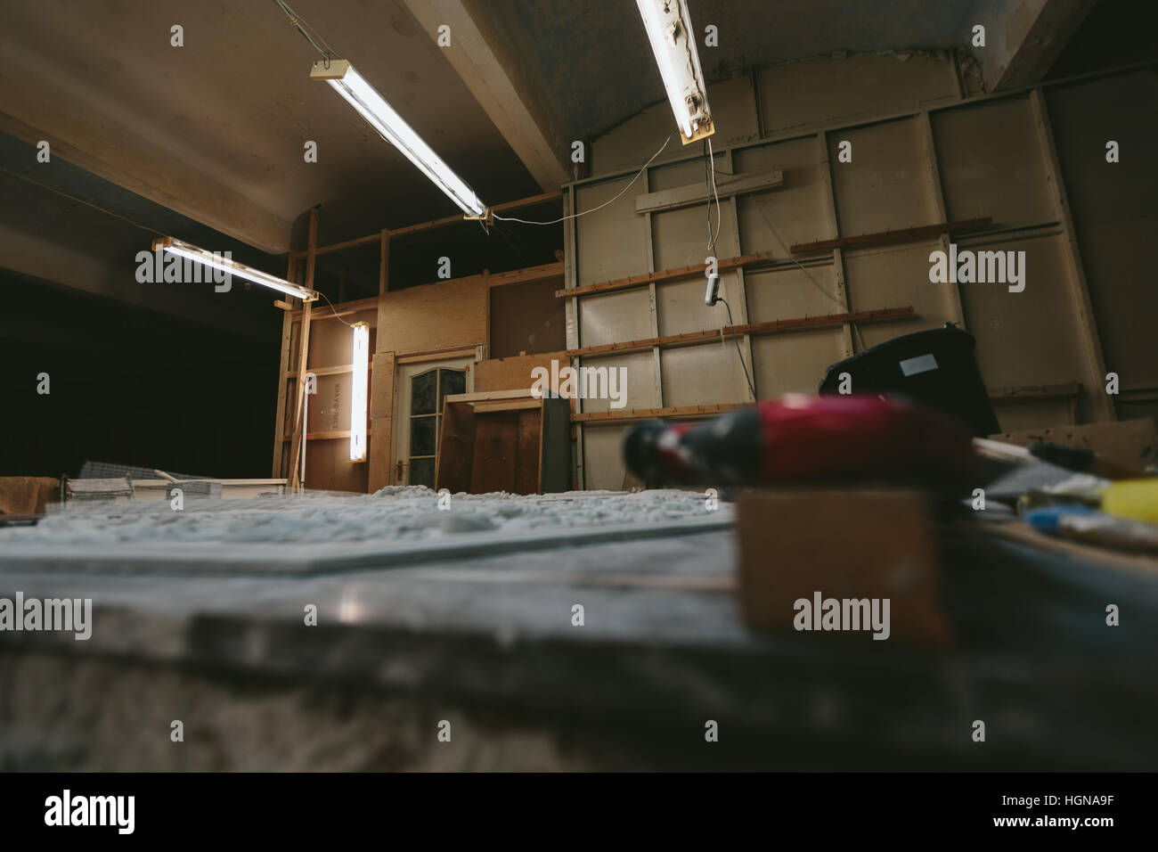 Factory for Production of plaster molds. cluttered dusty old warehouse ...