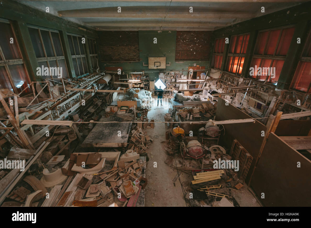 Factory for Production of plaster molds. cluttered dusty old warehouse ...