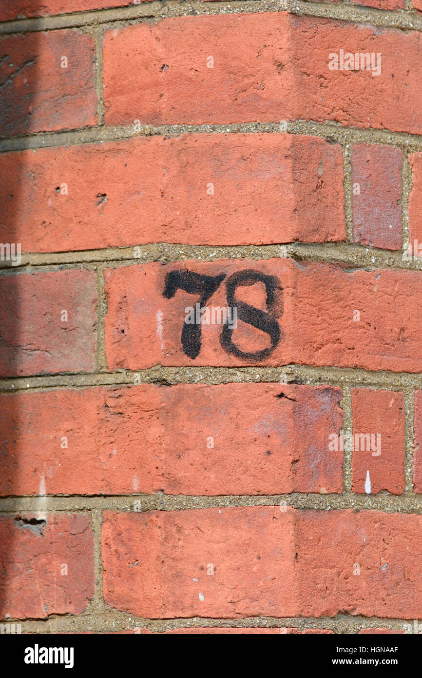 House Number 78 sign painted black on red brick wall Stock Photo - Alamy