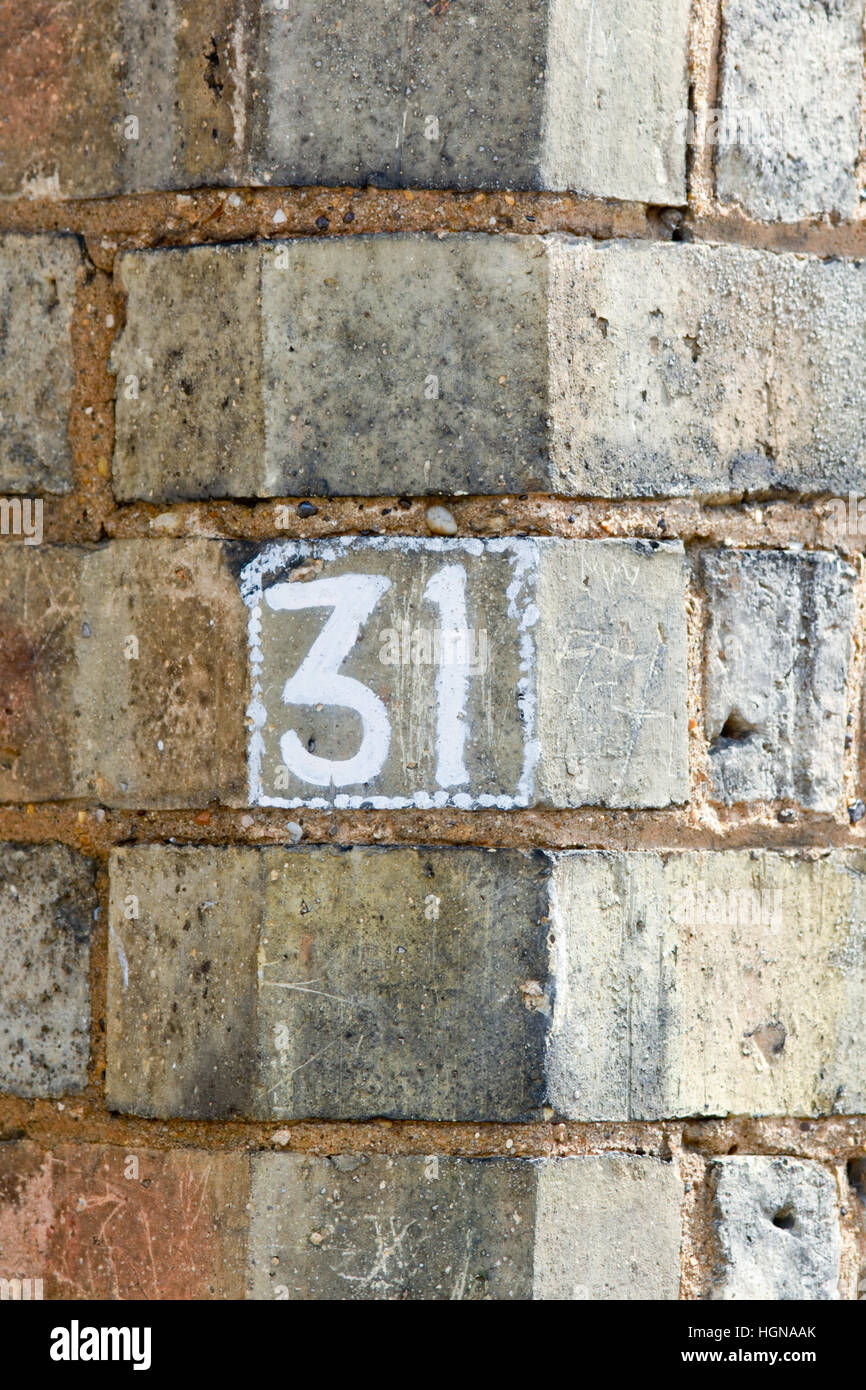 House Number 31 sign painted white on wall Stock Photo - Alamy