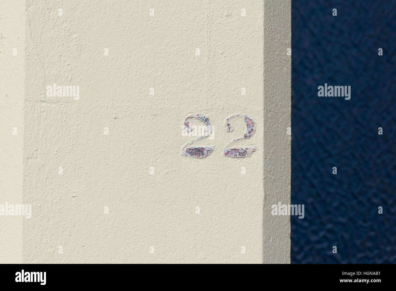 Faded house number 22 sign on wall Stock Photo - Alamy