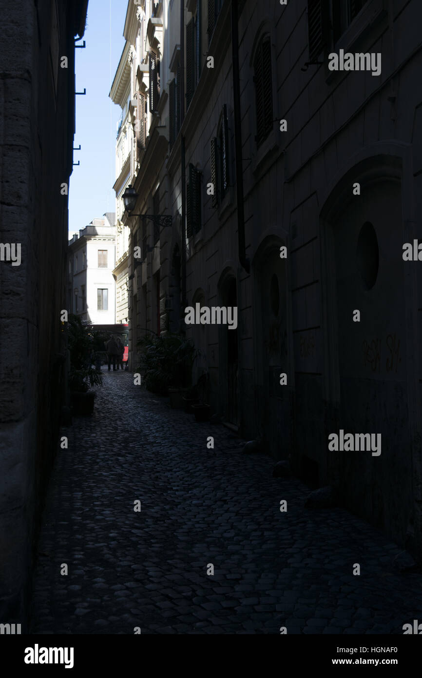 alleys in Rome with lights and shadows Stock Photo - Alamy