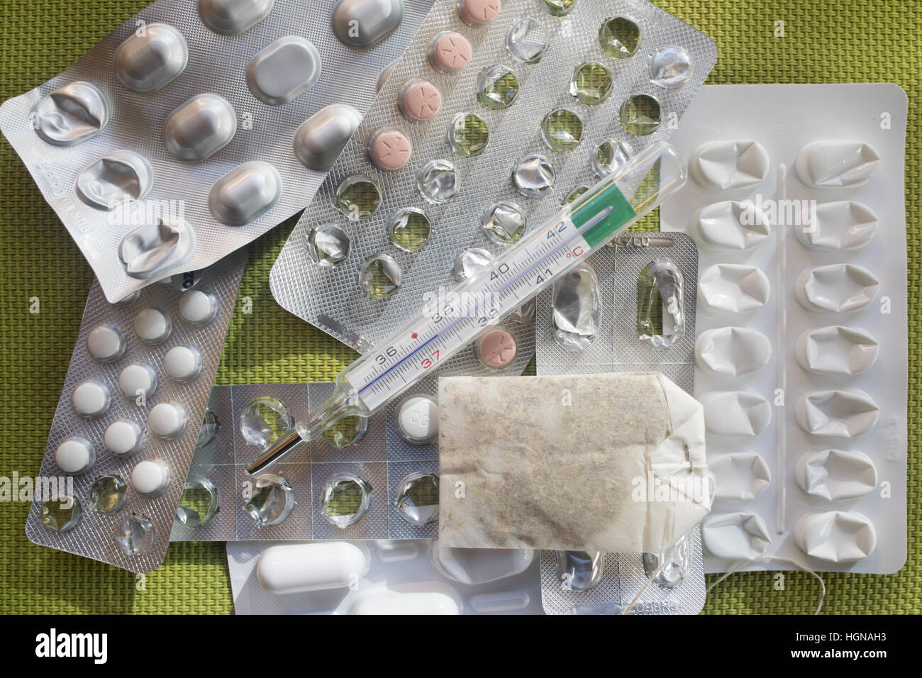 pills thermometer and infusion for flu and cold Stock Photo - Alamy