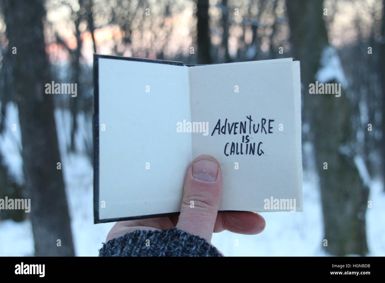 Adventure is calling, travel idea. Book and text Stock Photo - Alamy