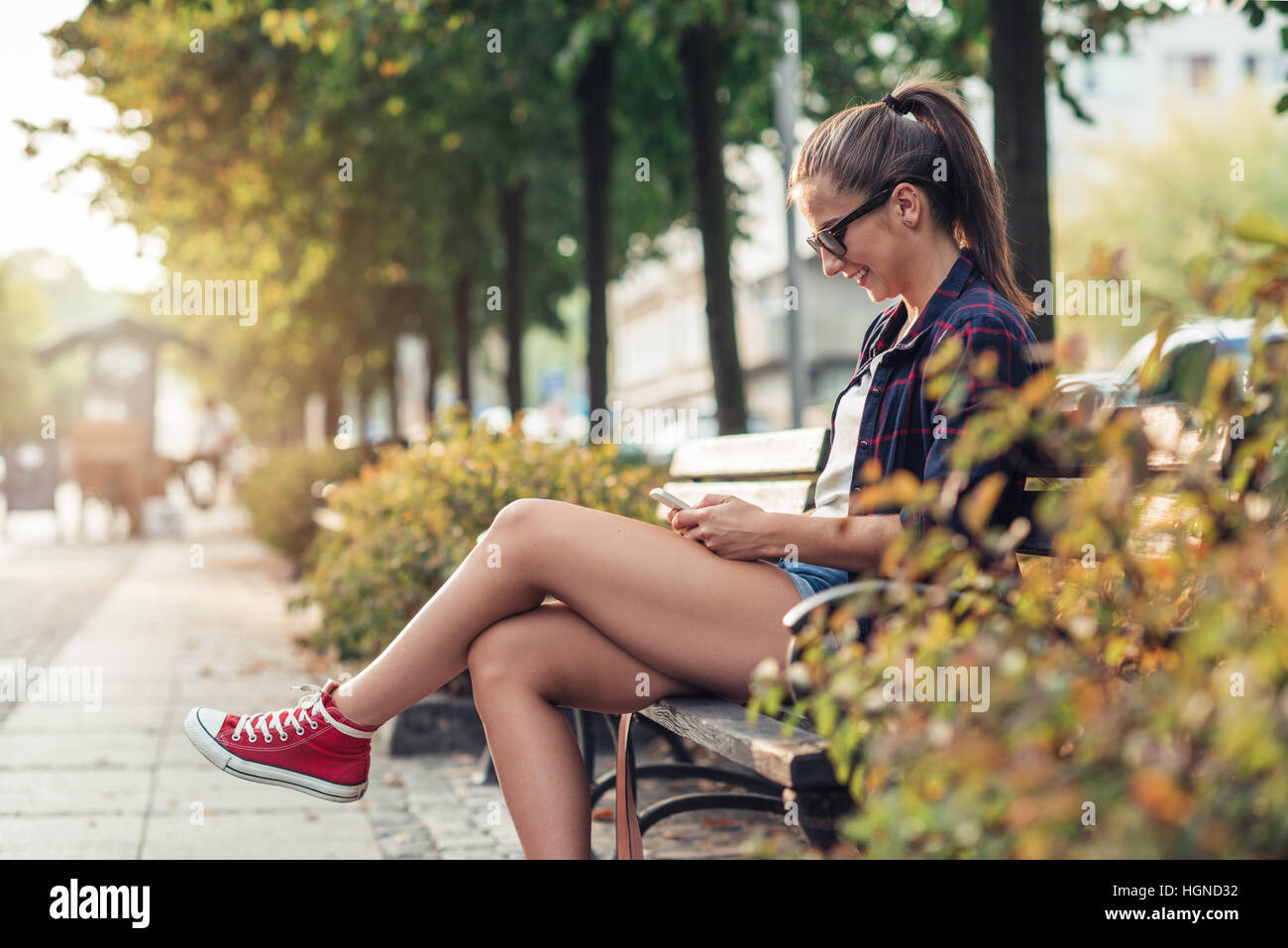 Beautiful young woman texting message hi-res stock photography and ...