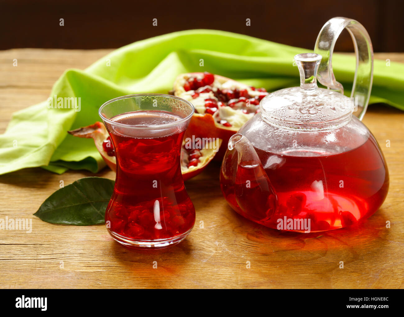 Fruit pomegranate tea in a teapot and cup Stock Photo - Alamy