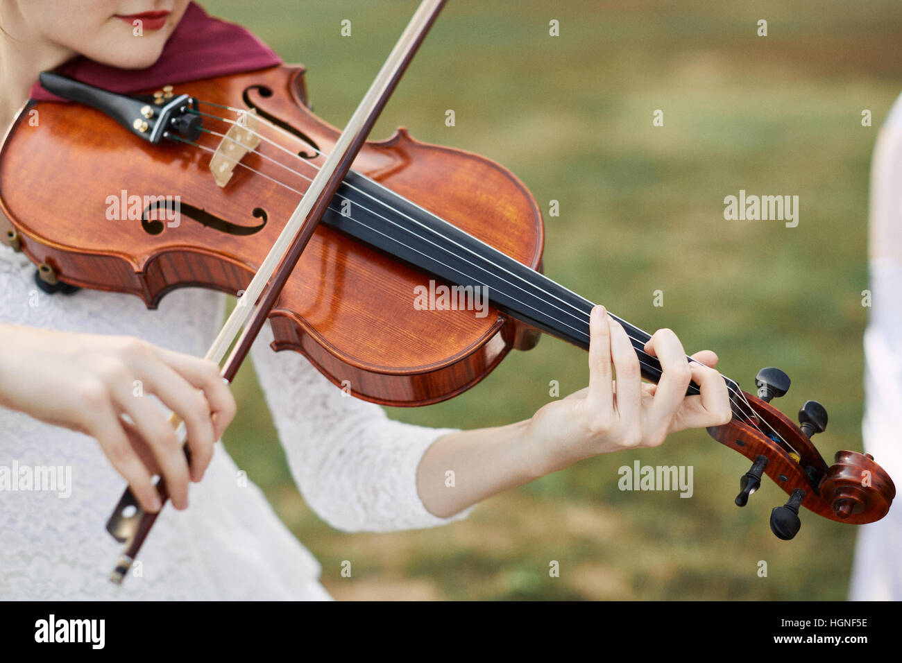 Beautiful young woman playing violin hi-res stock photography and ...