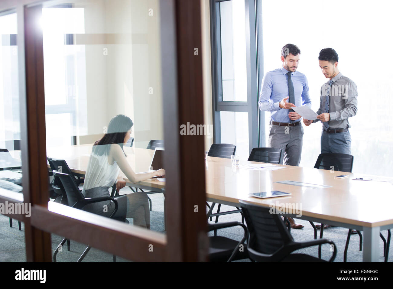 Business people talking in meeting room Stock Photo - Alamy