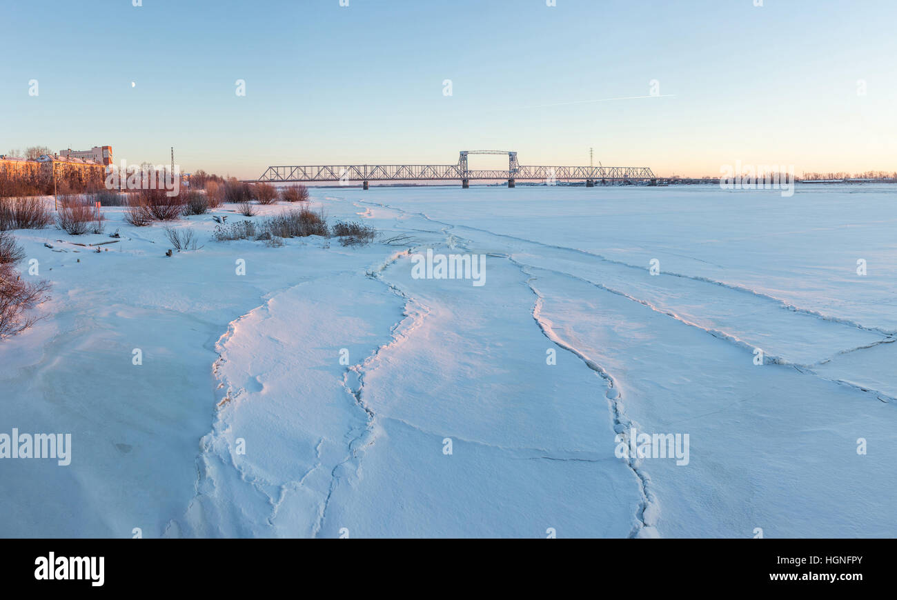 Frozen river Northern Dvina and Railway bridge in Arkhangelsk, Russia ...