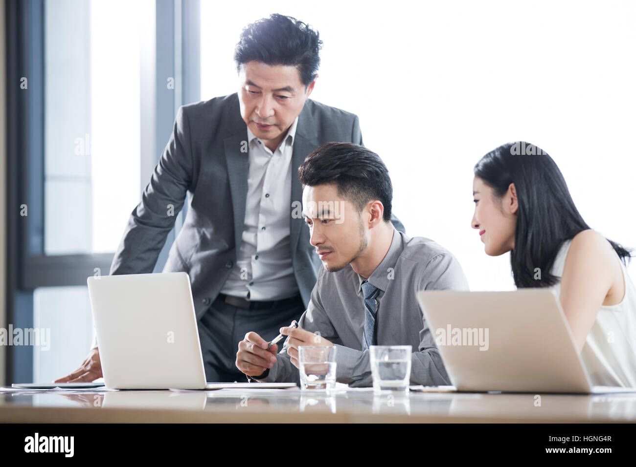 Business people talking in meeting room Stock Photo - Alamy