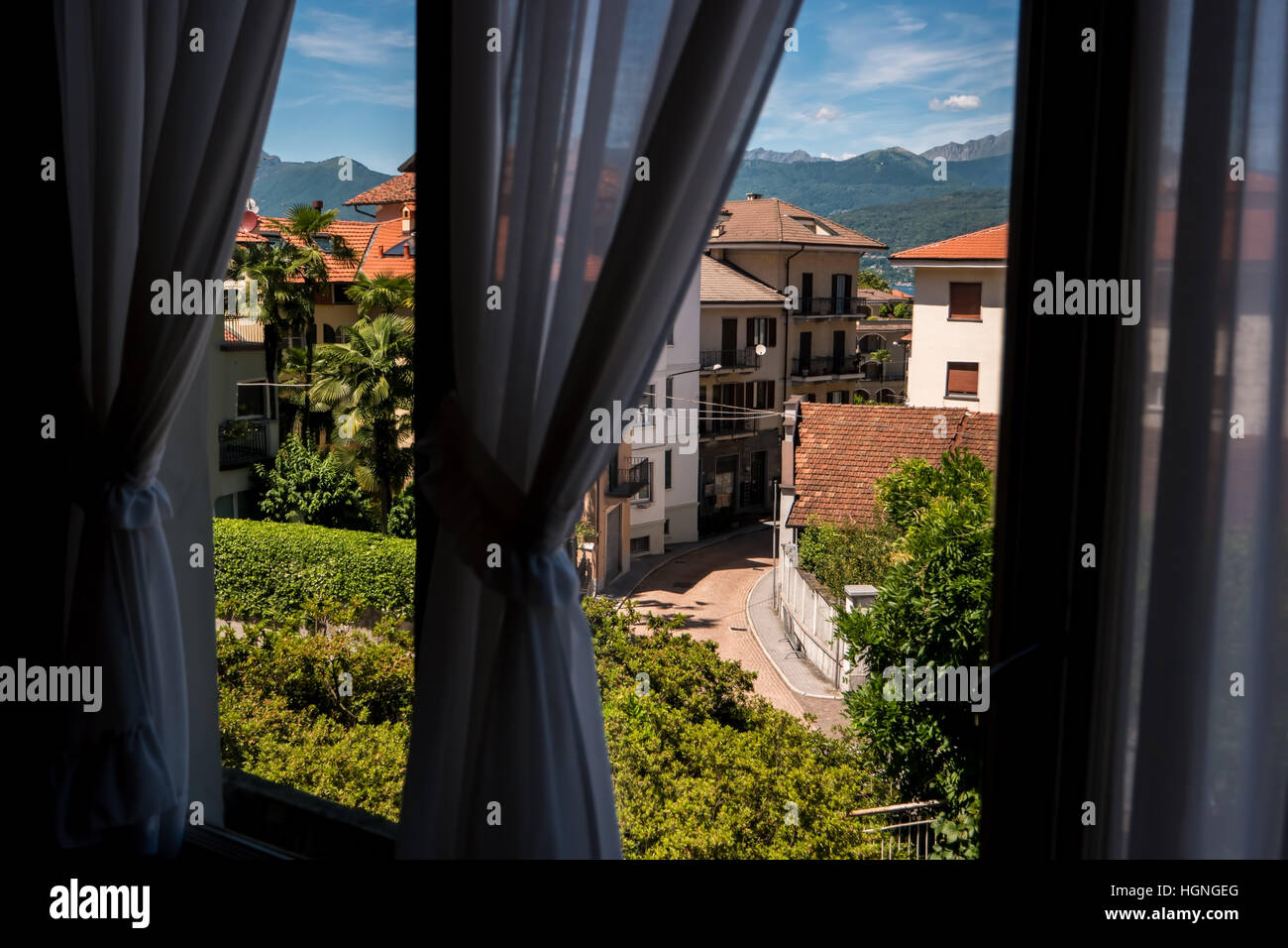 Nature and town behind window Stock Photo - Alamy