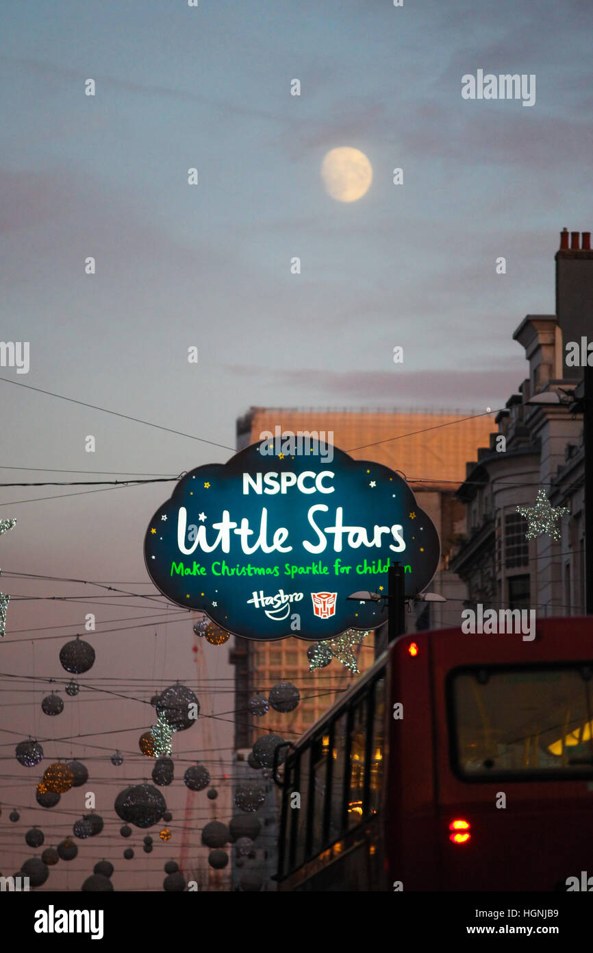 The moon, the star and Christmas lights over Oxford Street, London, at ...