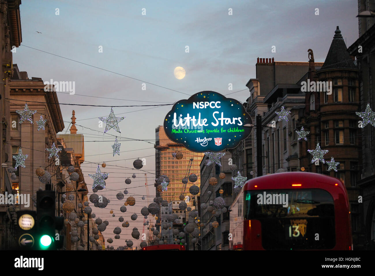 The moon, the star and Christmas lights over Oxford Street, London, at ...