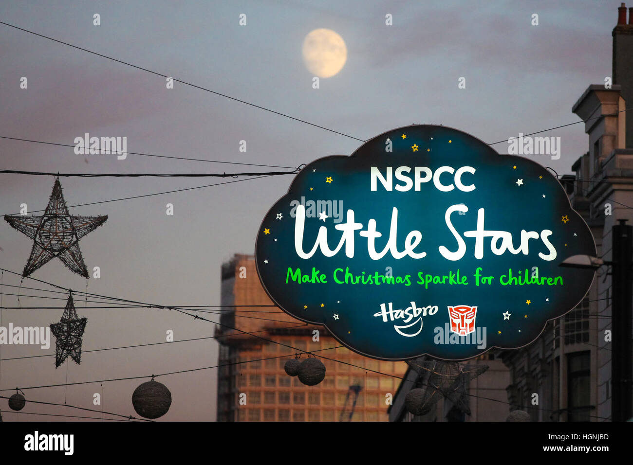 The moon, the star and Christmas lights over Oxford Street, London, at ...