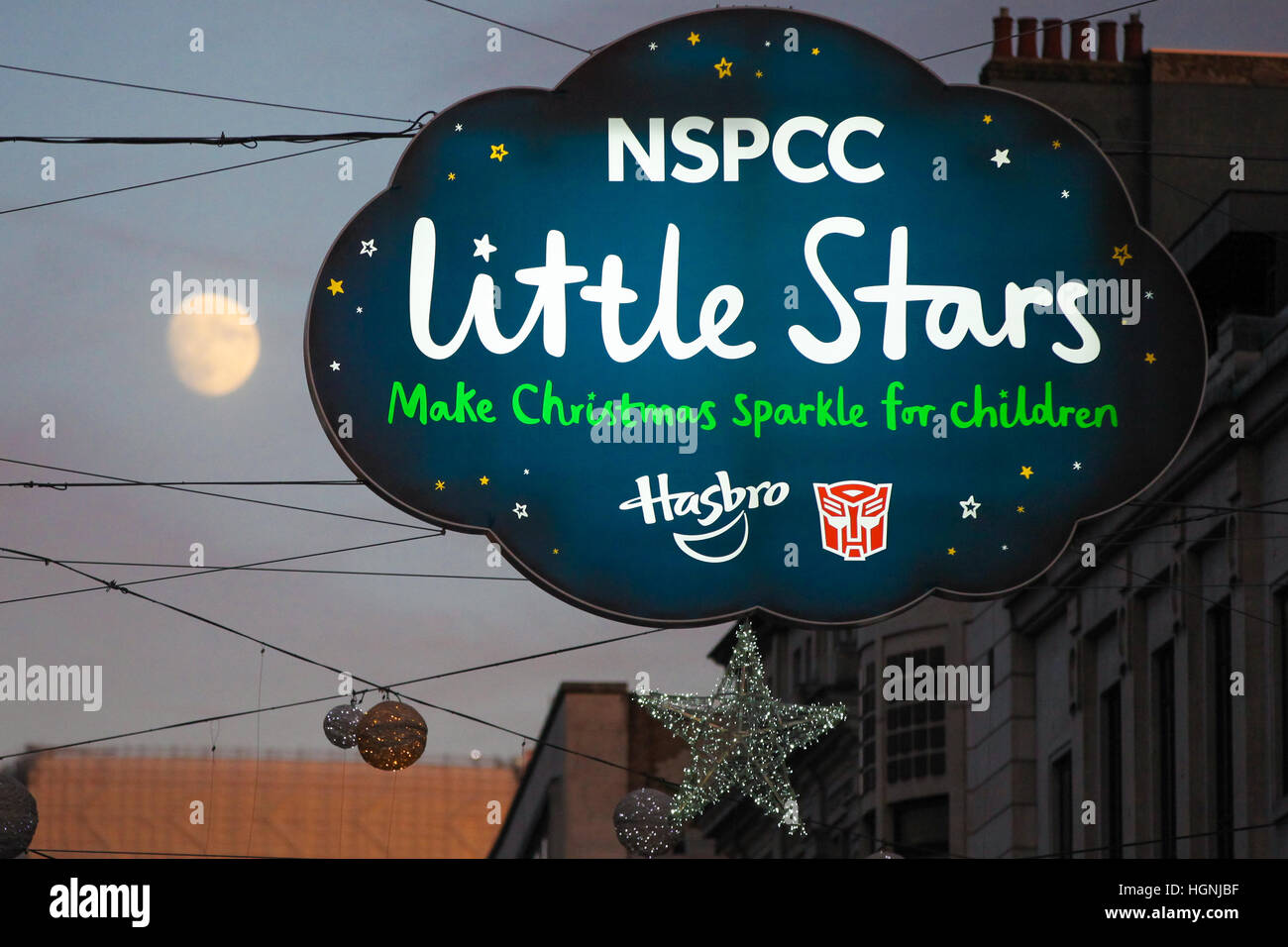 The moon, the star and Christmas lights over Oxford Street, London, at ...