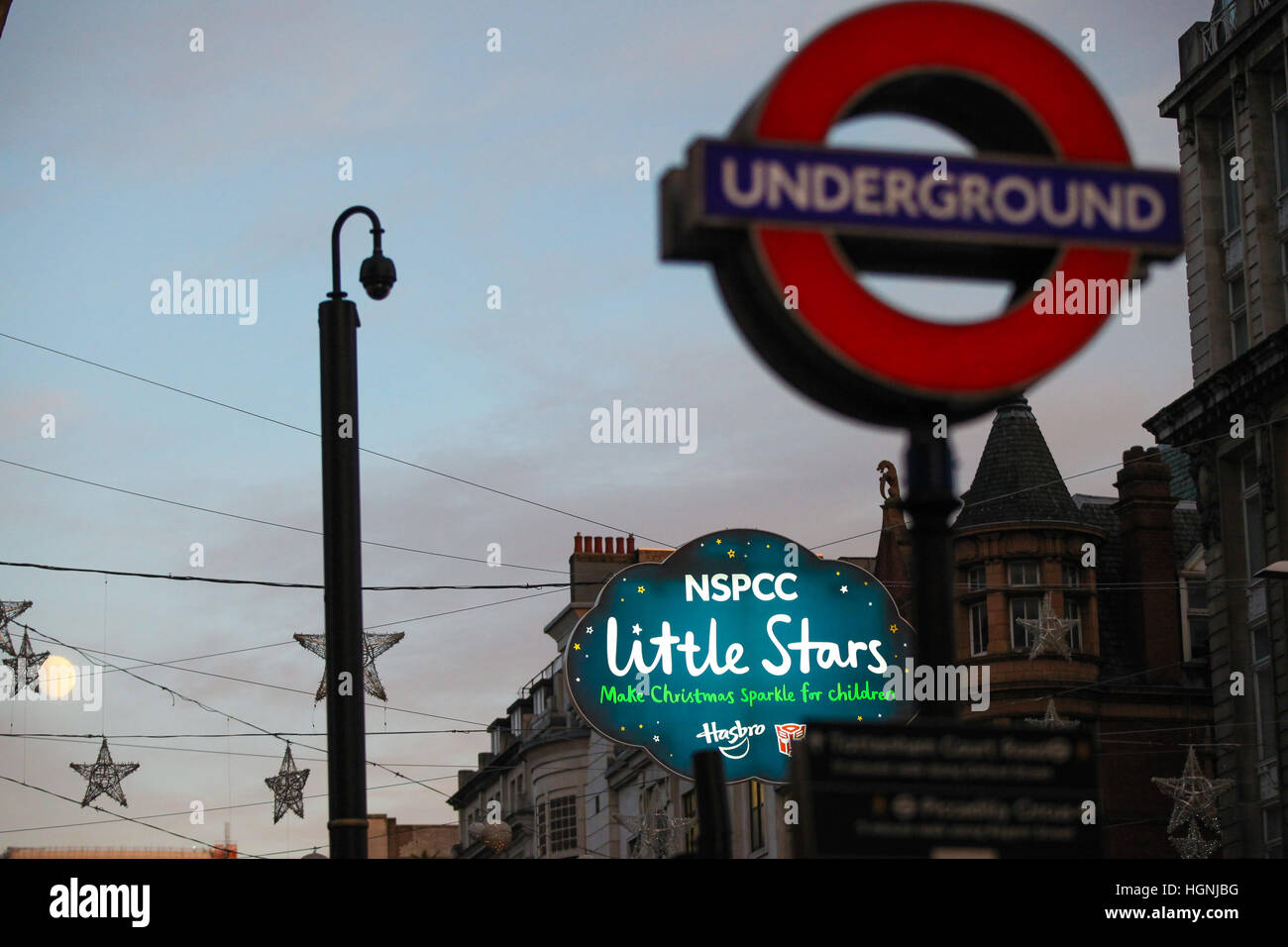 The moon, the star and Christmas lights over Oxford Street, London, at ...