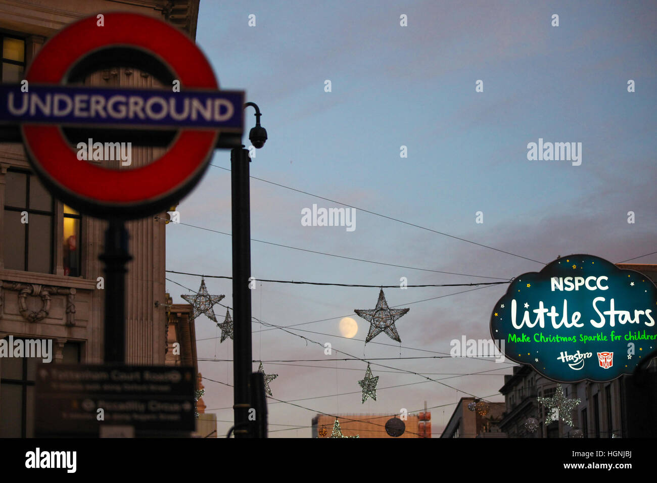 The moon, the star and Christmas lights over Oxford Street, London, at ...