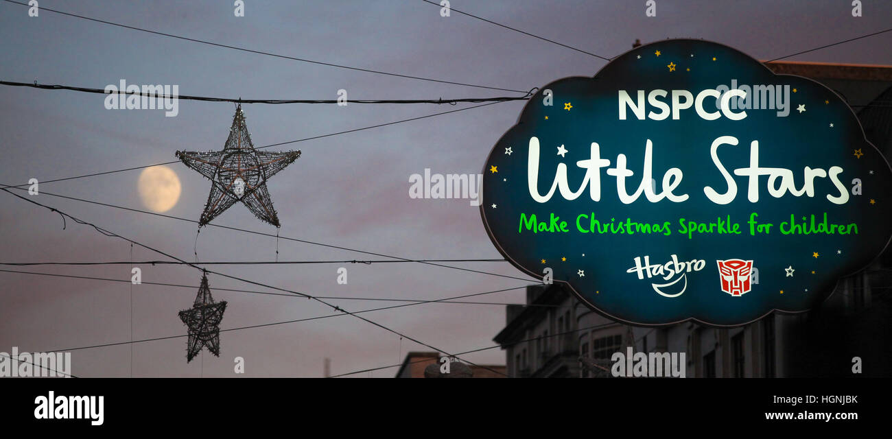 The moon, the star and Christmas lights over Oxford Street, London, at ...