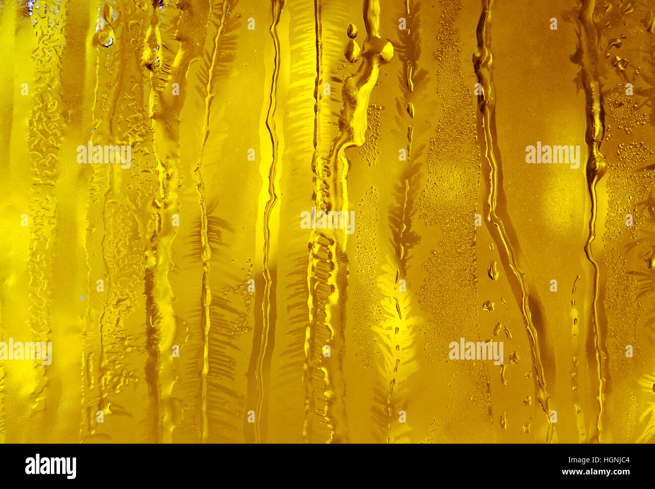 Golden frosty glass with ice flowers as a background Stock Photo - Alamy