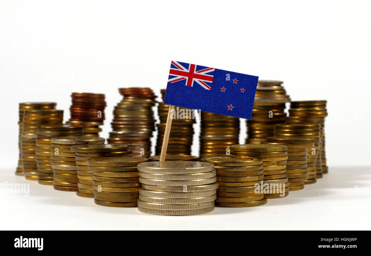 New Zealand flag waving with stack of money coins Stock Photo - Alamy