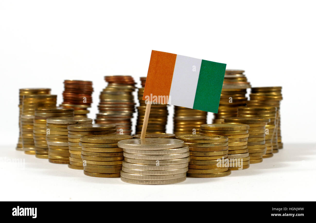 Ivory Coast flag waving with stack of money coins Stock Photo - Alamy