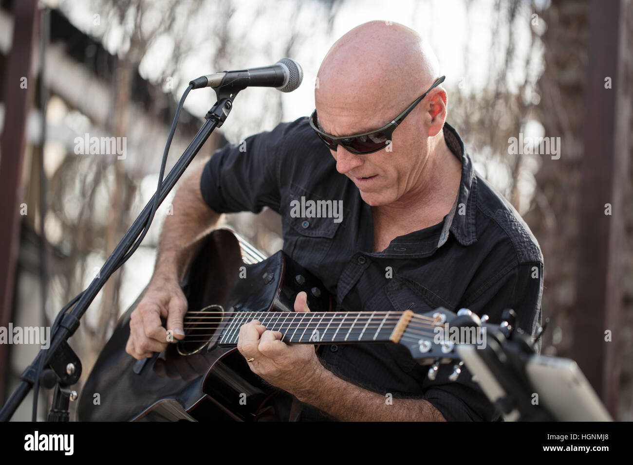 Music Duo singing and playing guitar at an outdoor venue Stock Photo ...