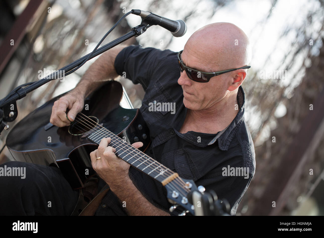 Music Duo singing and playing guitar at an outdoor venue Stock Photo ...