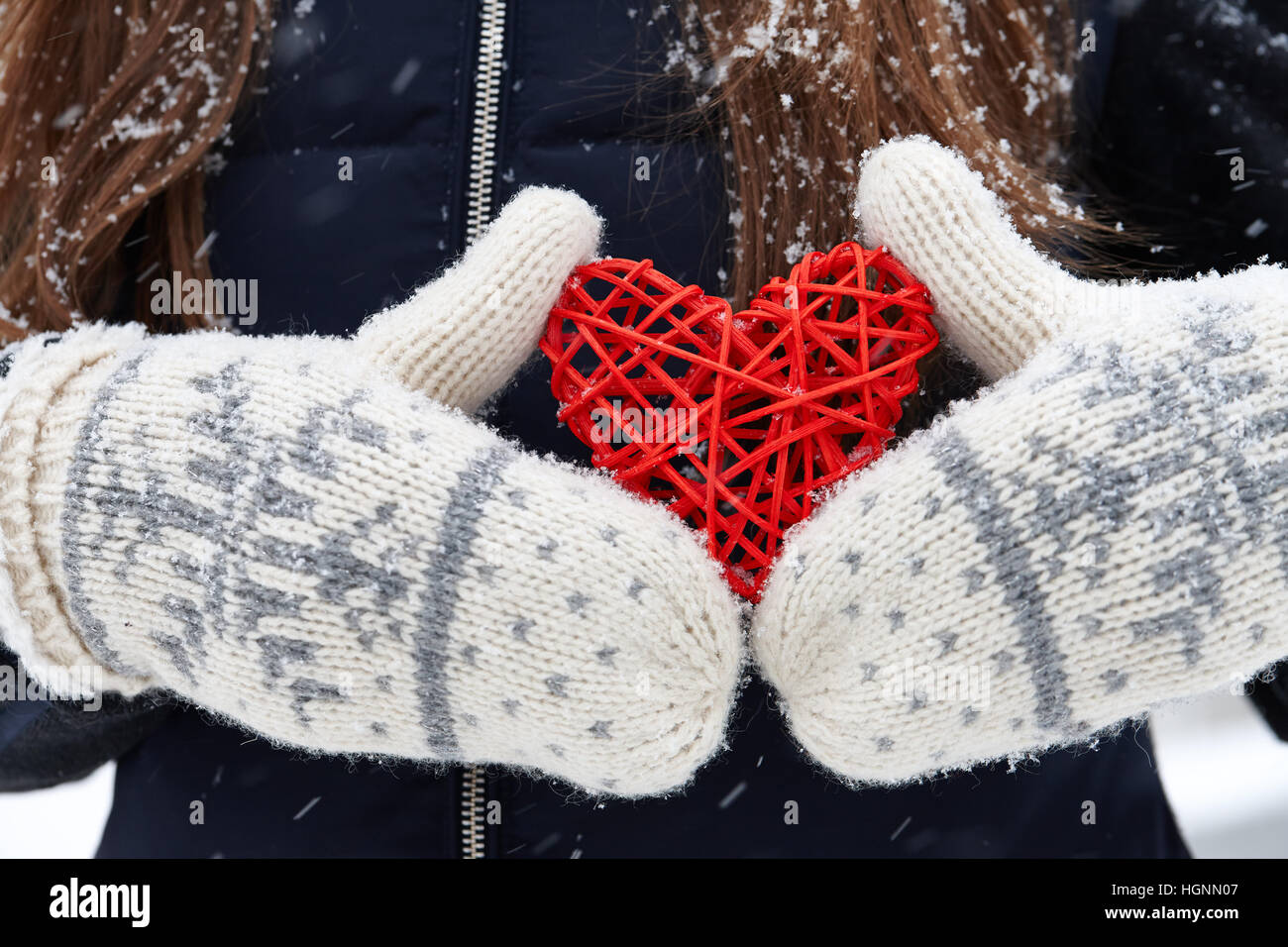 Rattan red heart in hands Stock Photo - Alamy