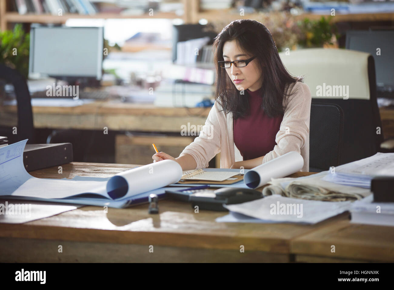 Female architect working in the office Stock Photo - Alamy