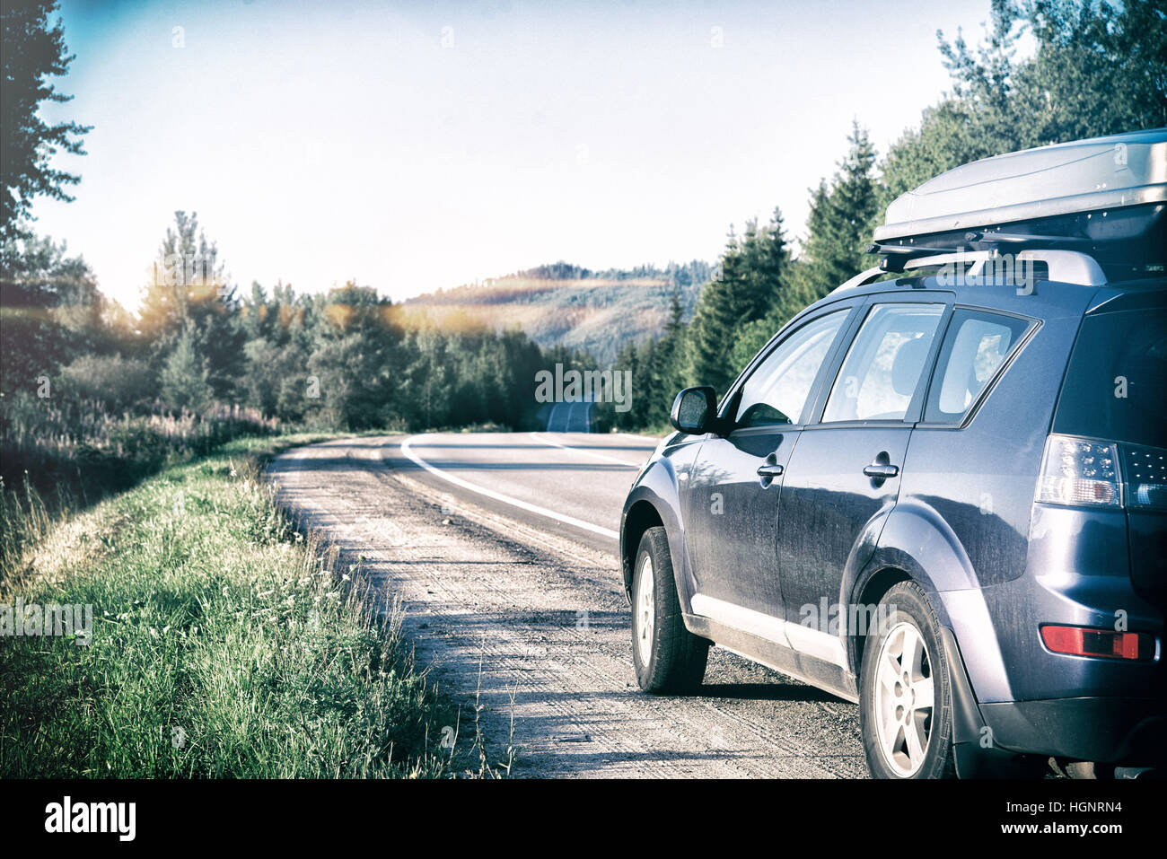 car for traveling with a mountain road Stock Photo - Alamy