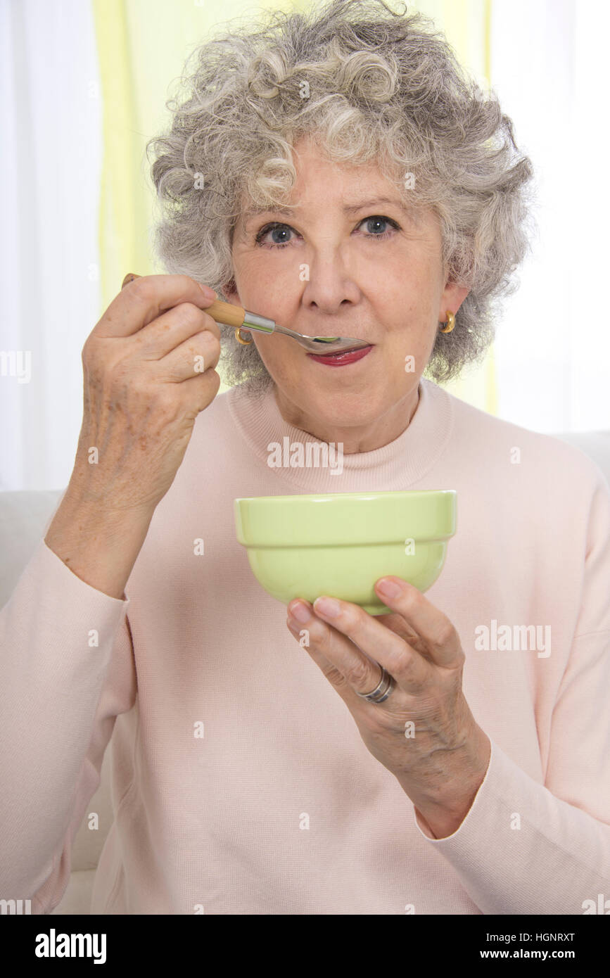 Old lady eating breakfast hi-res stock photography and images - Alamy
