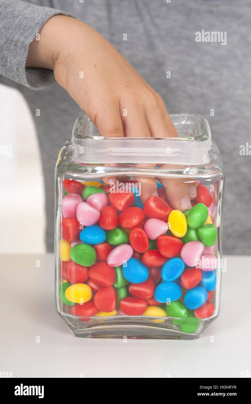 CHILD EATING SWEETS Stock Photo - Alamy
