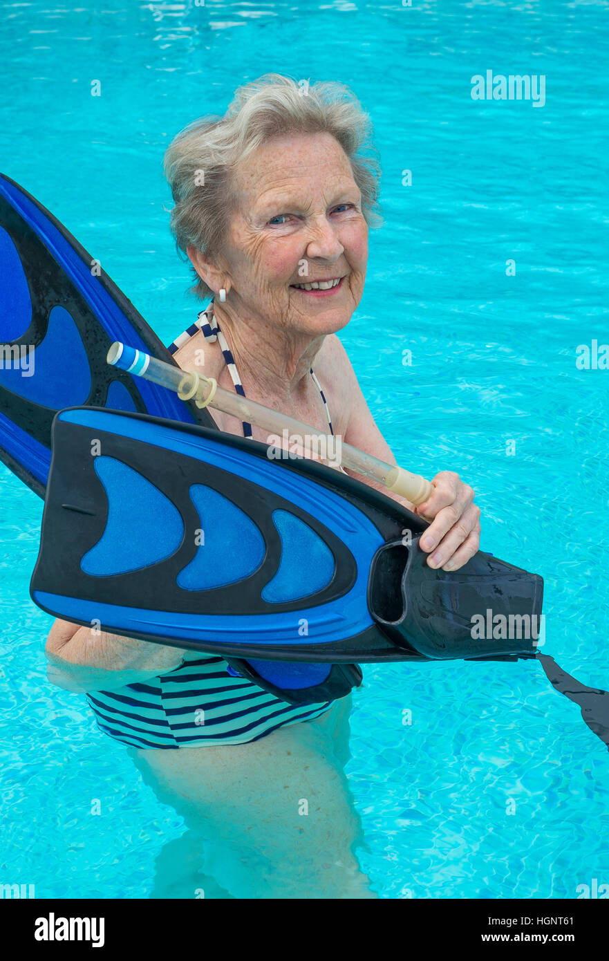 Older woman swimming in pool hi-res stock photography and images - Alamy