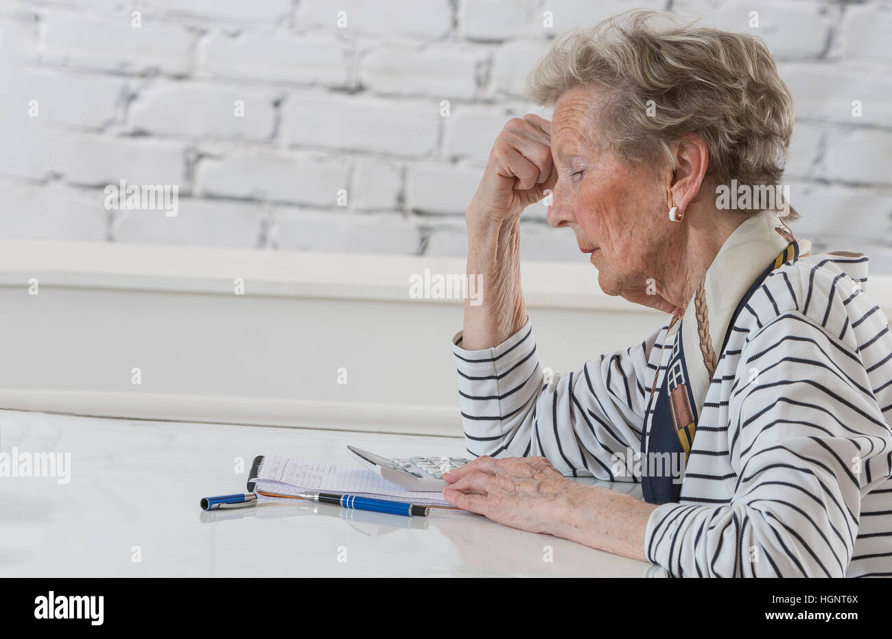 ELDERLY PERSON DOING PAPERWORK Stock Photo - Alamy