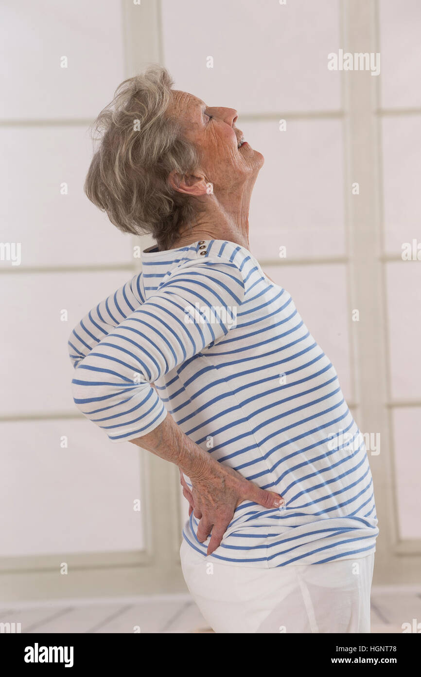 SENIOR WITH LOWER BACK PAIN Stock Photo - Alamy