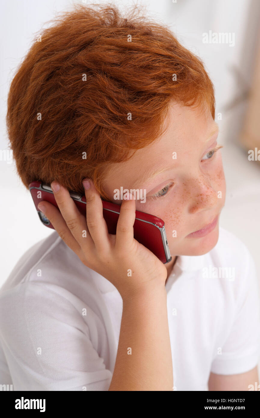 Child and 8 years old and mobile phone hi-res stock photography and ...