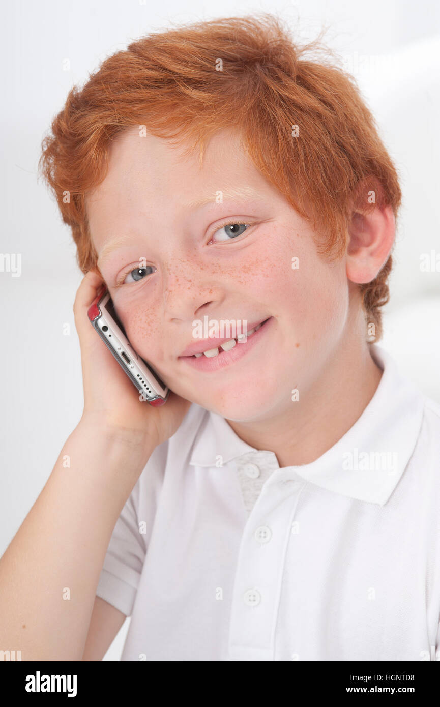 CHILD WITH PHONE Stock Photo - Alamy