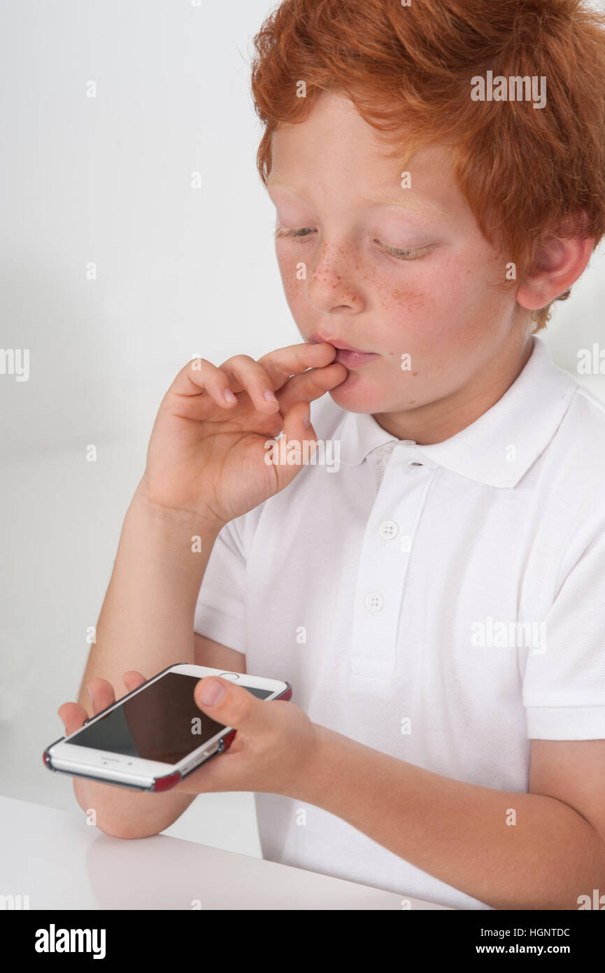 CHILD WITH PHONE Stock Photo - Alamy