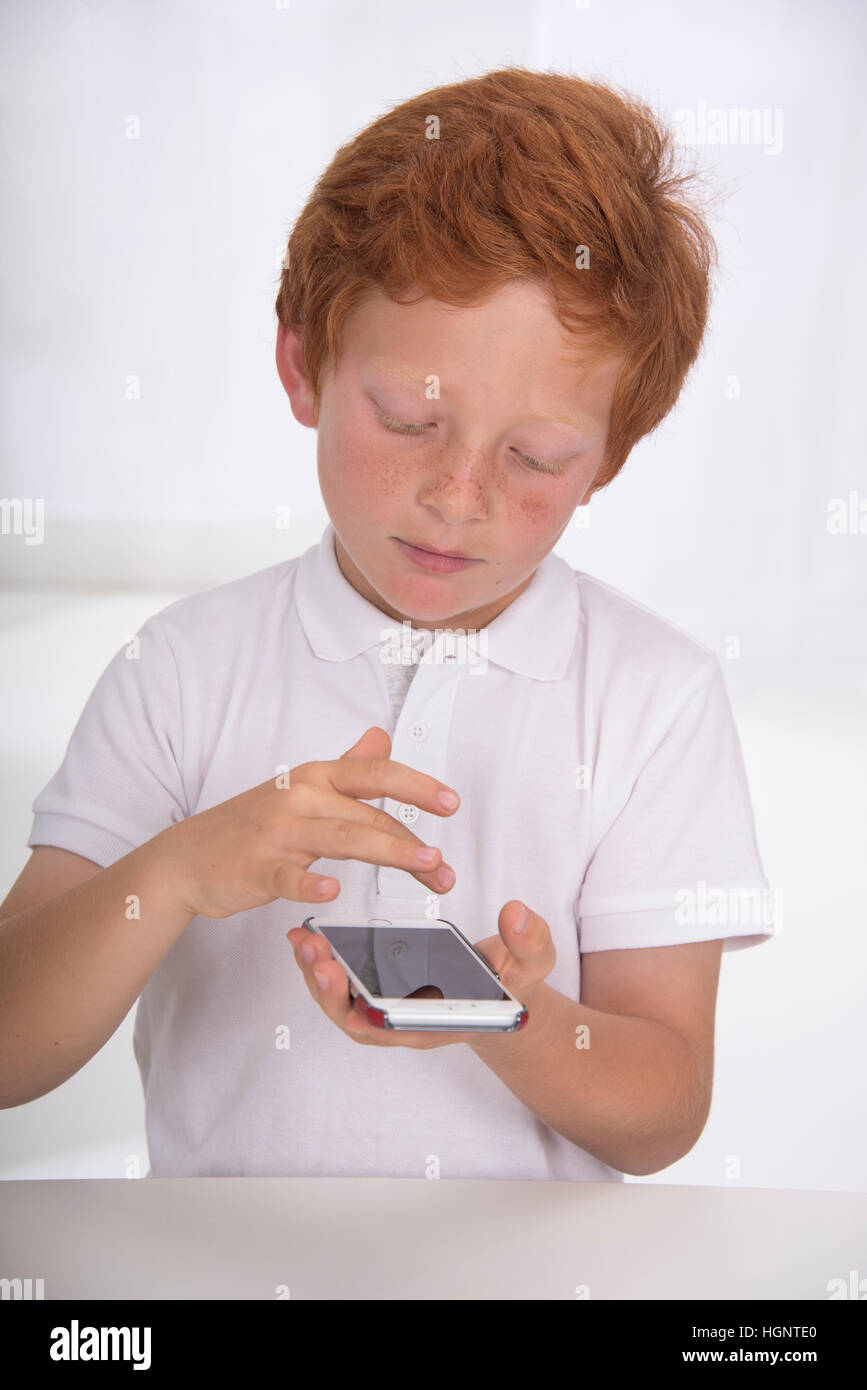 CHILD WITH PHONE Stock Photo - Alamy