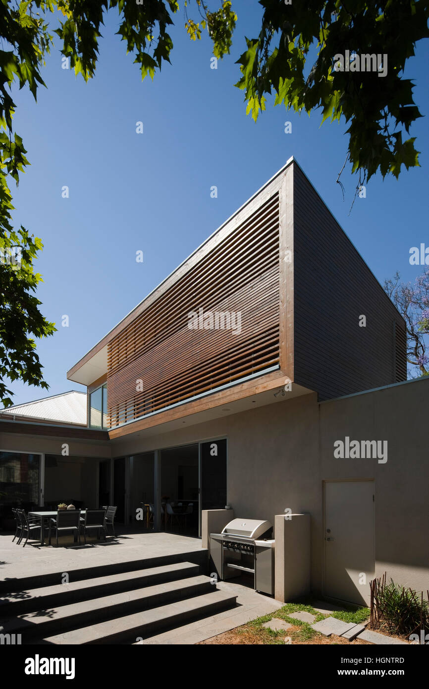 Three quarter view from backyards showing the outdoor patio and rear ...