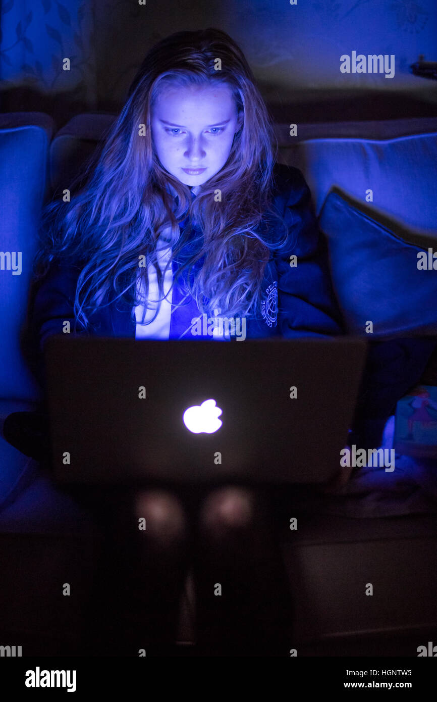 A teenager late at night on a laptop computer Stock Photo - Alamy