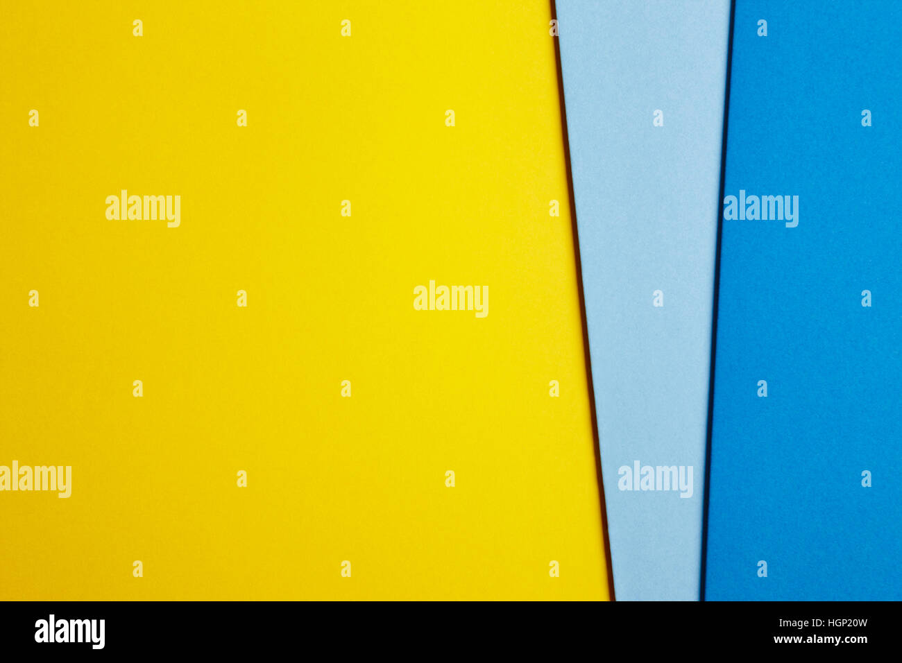 Colored cardboards background in yellow blue tone. Copy space ...