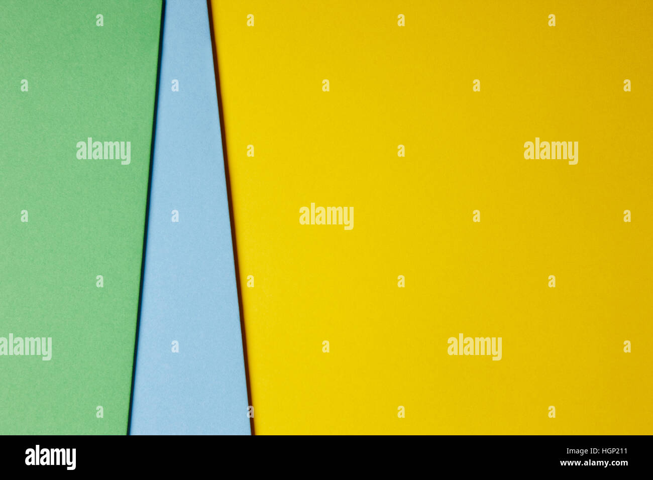 Colored cardboards background yellow blue green tone. Copy space ...
