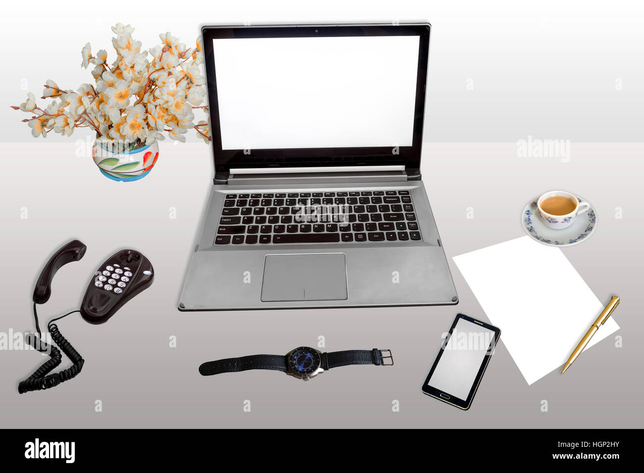 Work environment with laptop computer mobile and desk phone with white ...