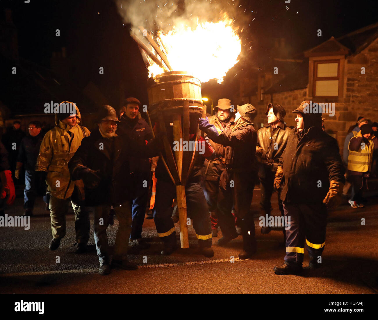The Clavie King and his Clavie Crew parade the Clavie through the ...