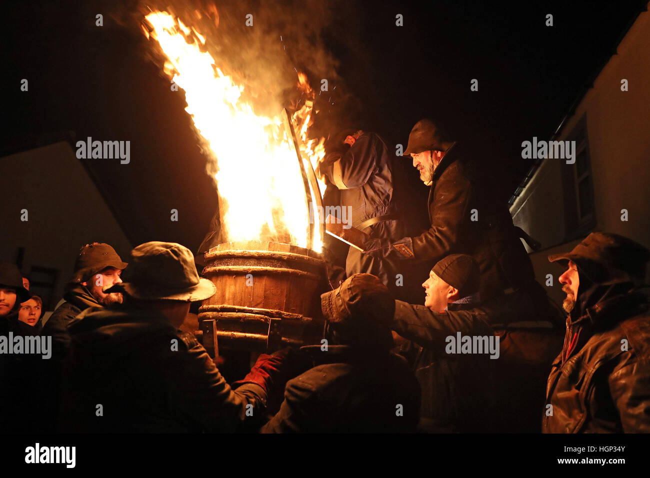 Members of the Clavie crew load up the Clavie as they parade the Clavie ...
