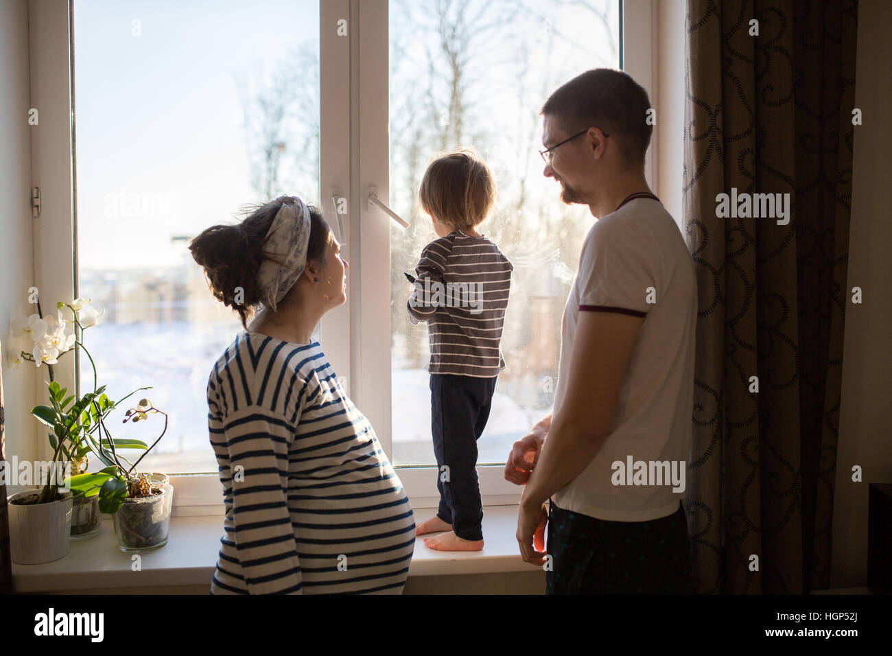 happy family with son kid toddler playing around window, home real ...