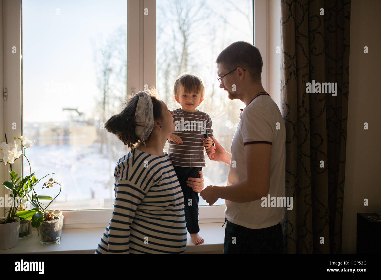 happy family with son kid toddler playing around window, home real ...