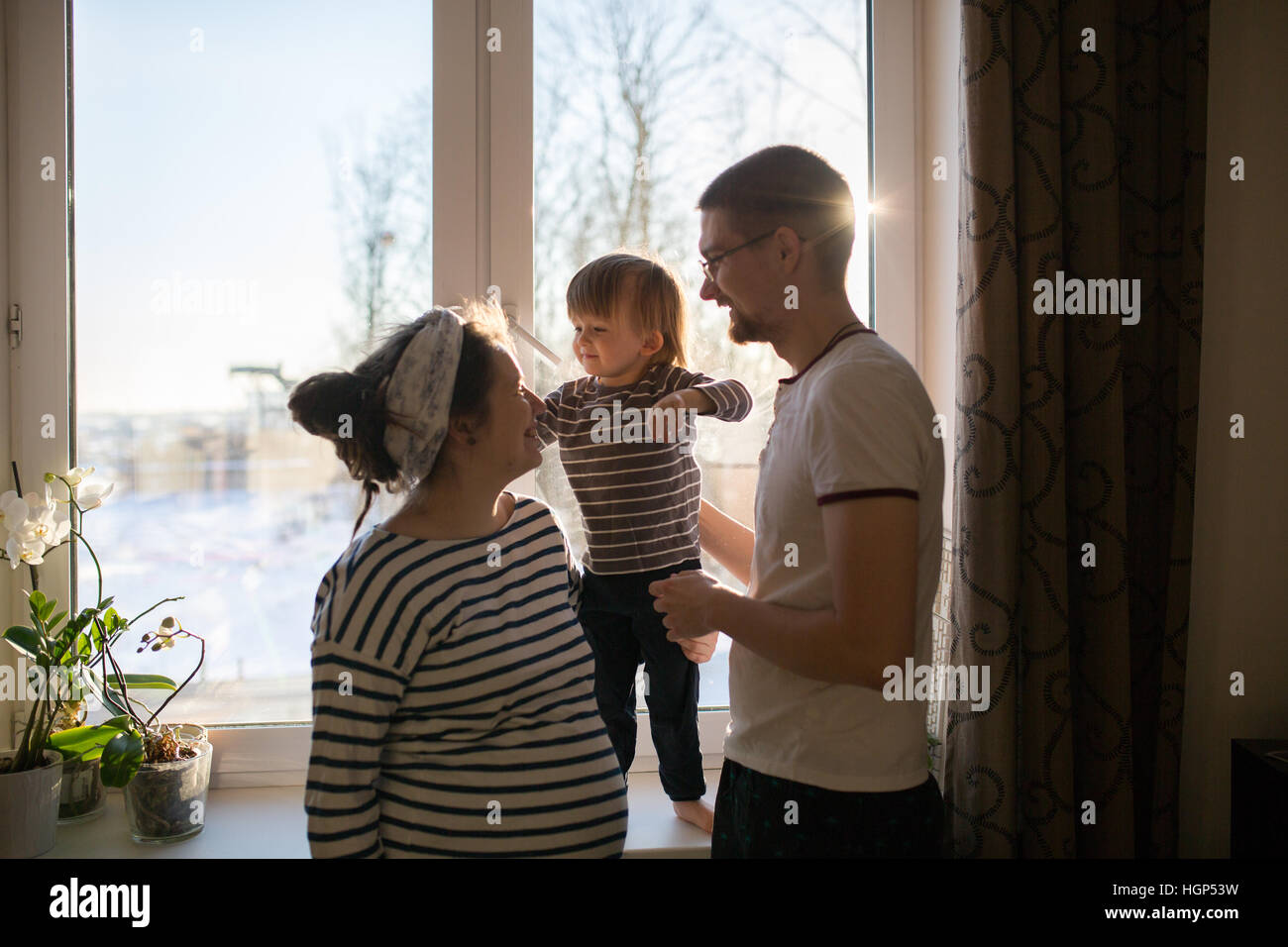 happy family with son kid toddler playing around window, home real ...