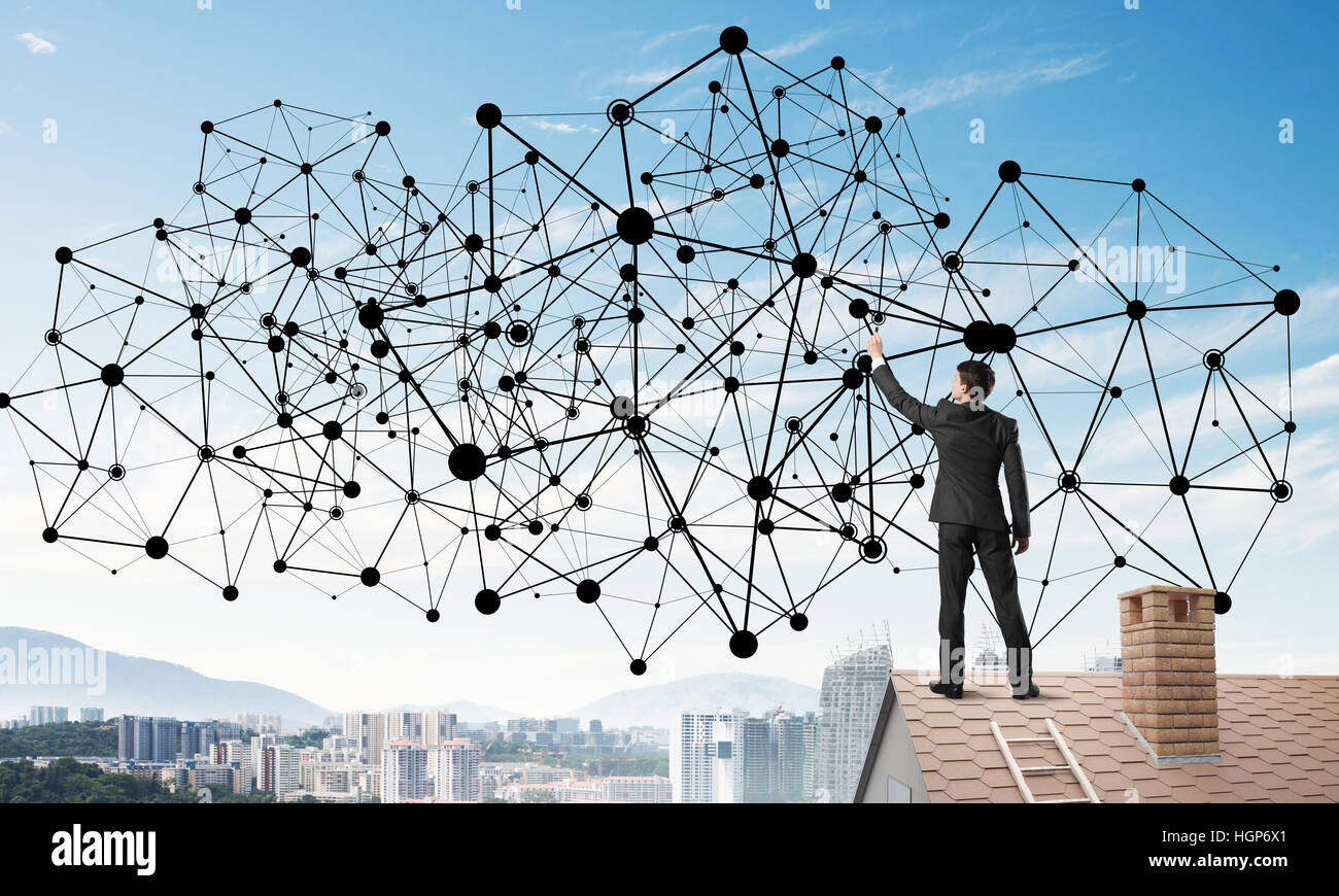 Businessman on house roof presenting networking and connection concept ...